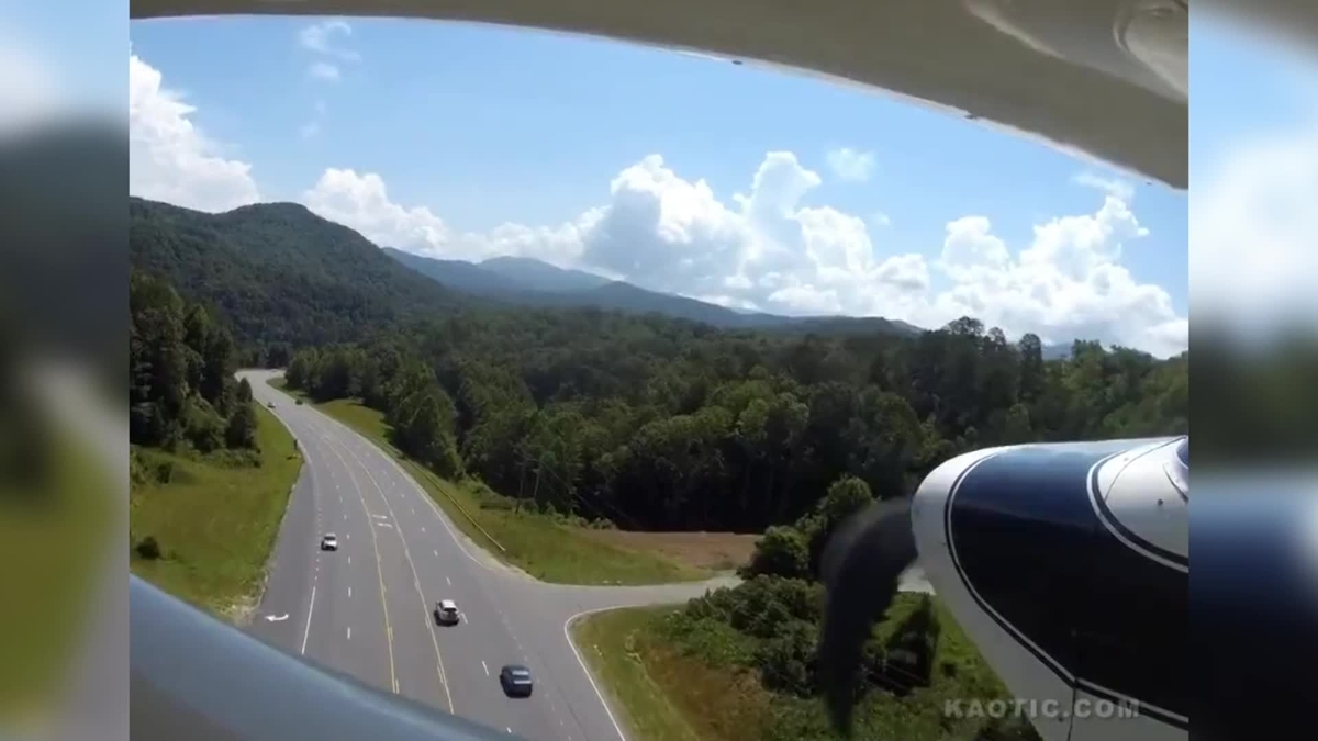 Pilot dodges between cars after making emergency landing on highway ...
