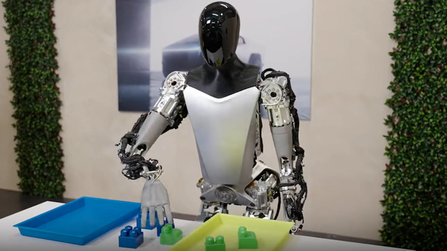 Optimus, el androide de Elon Musk que hace yoga y juega con cubos ...
